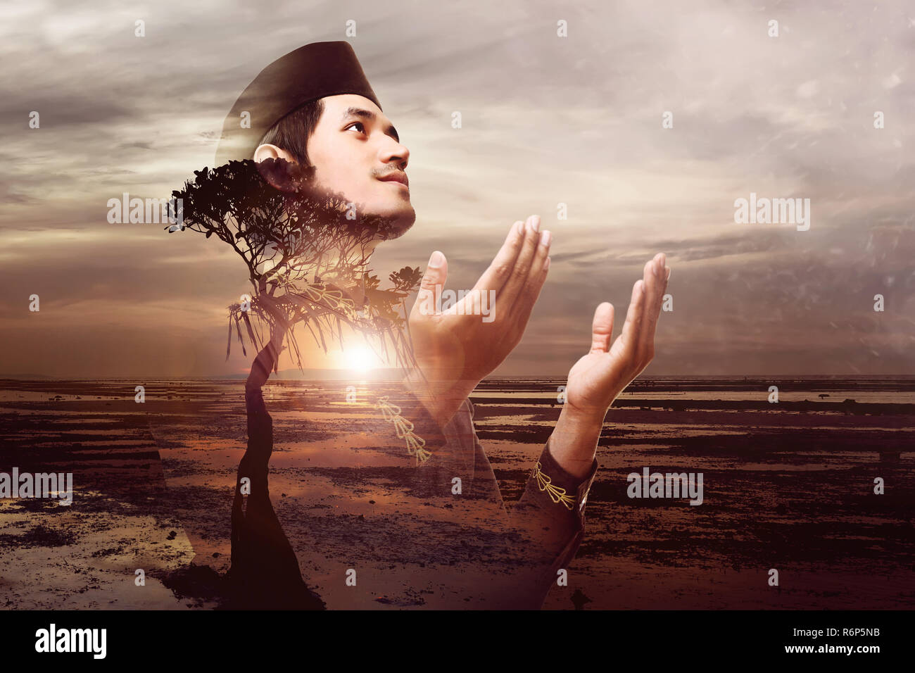 Handsome asian muslim man pray to god Stock Photo - Alamy