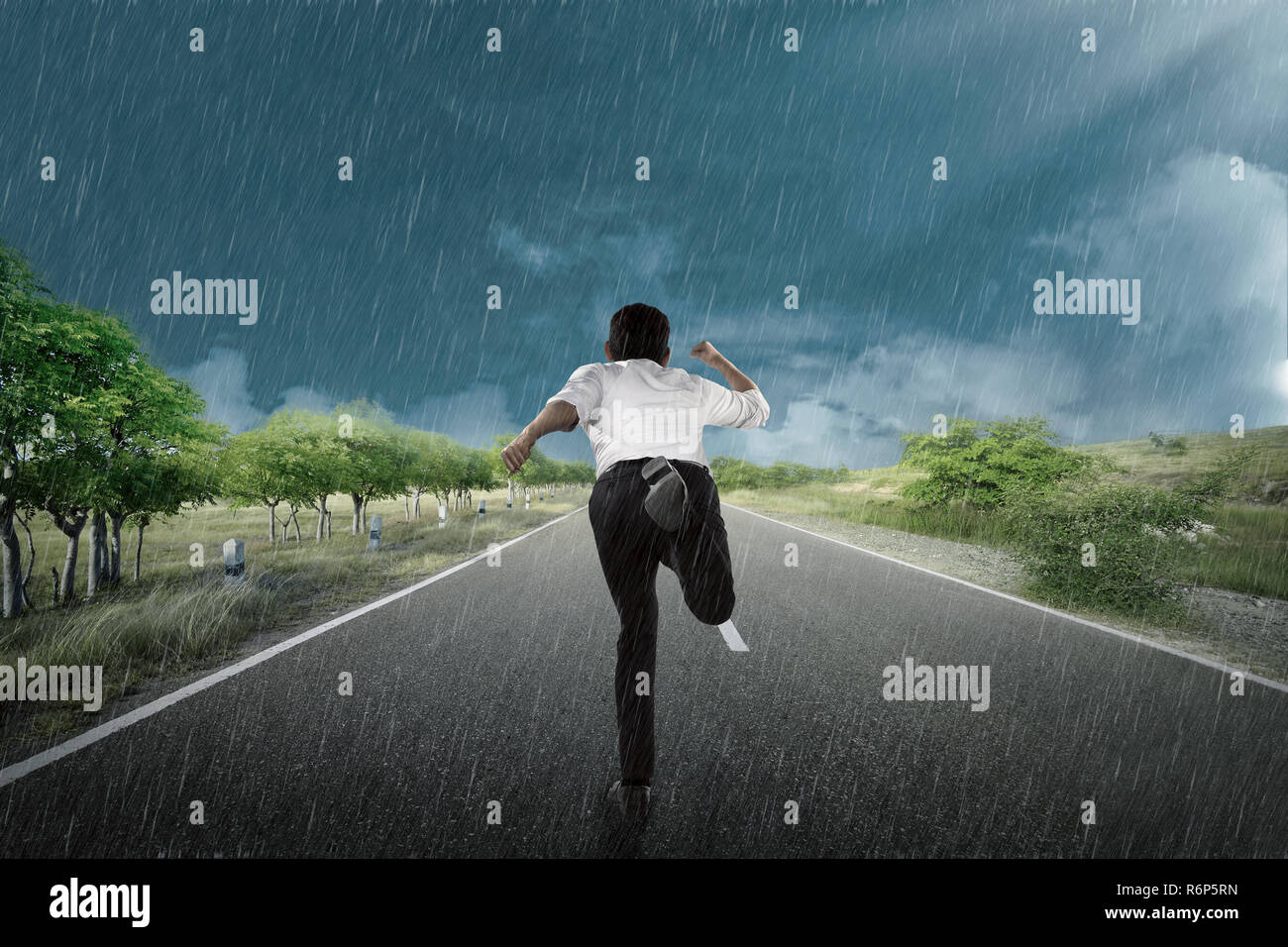 Businessman running rain hi-res stock photography and images - Alamy