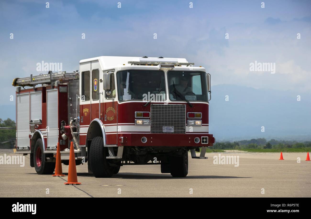 A 612th Air Base Squadron Firefighter instructs the 612th ABS Commander ...