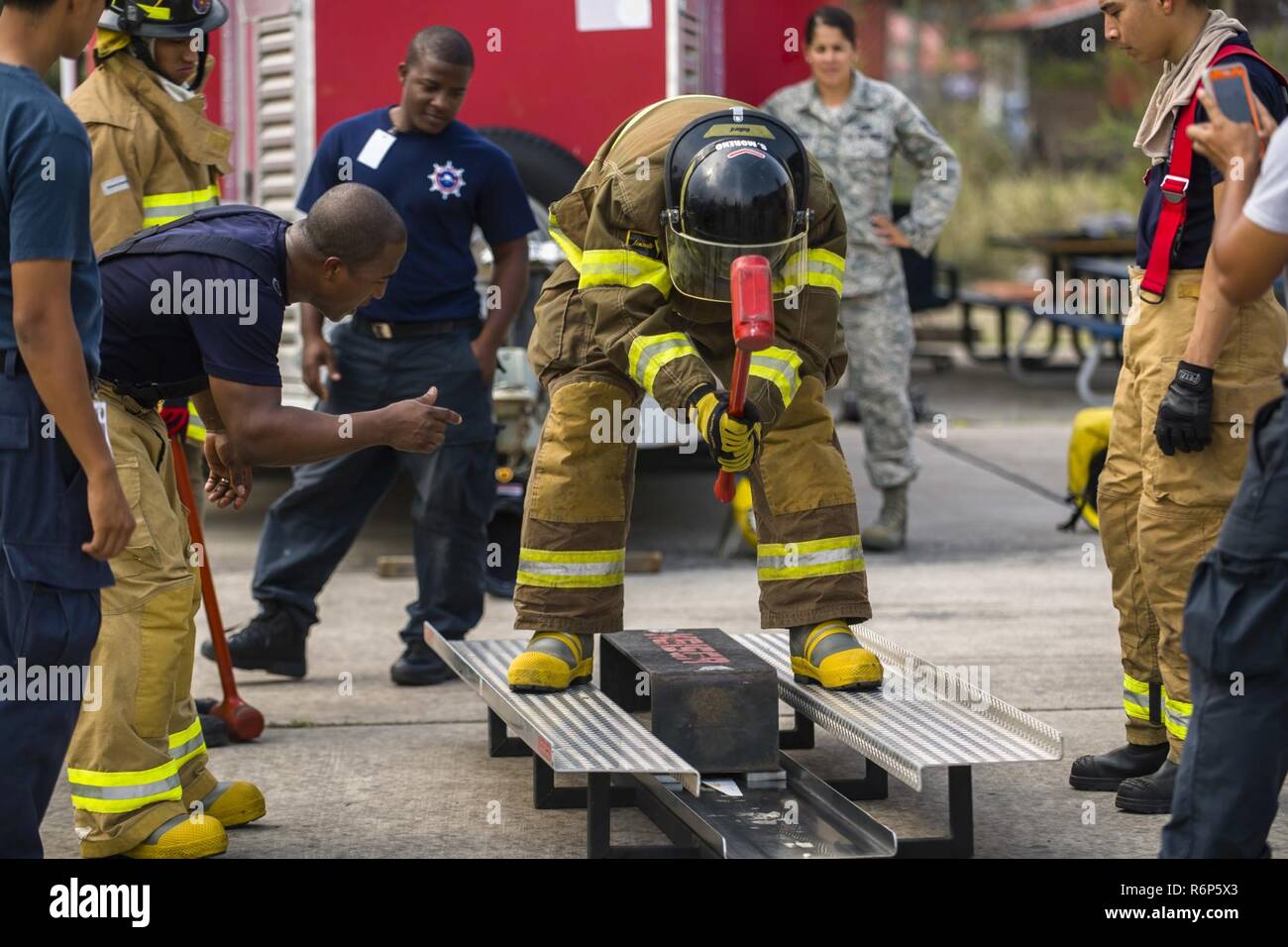 A firefighter from Central America participate in a timed event after ...