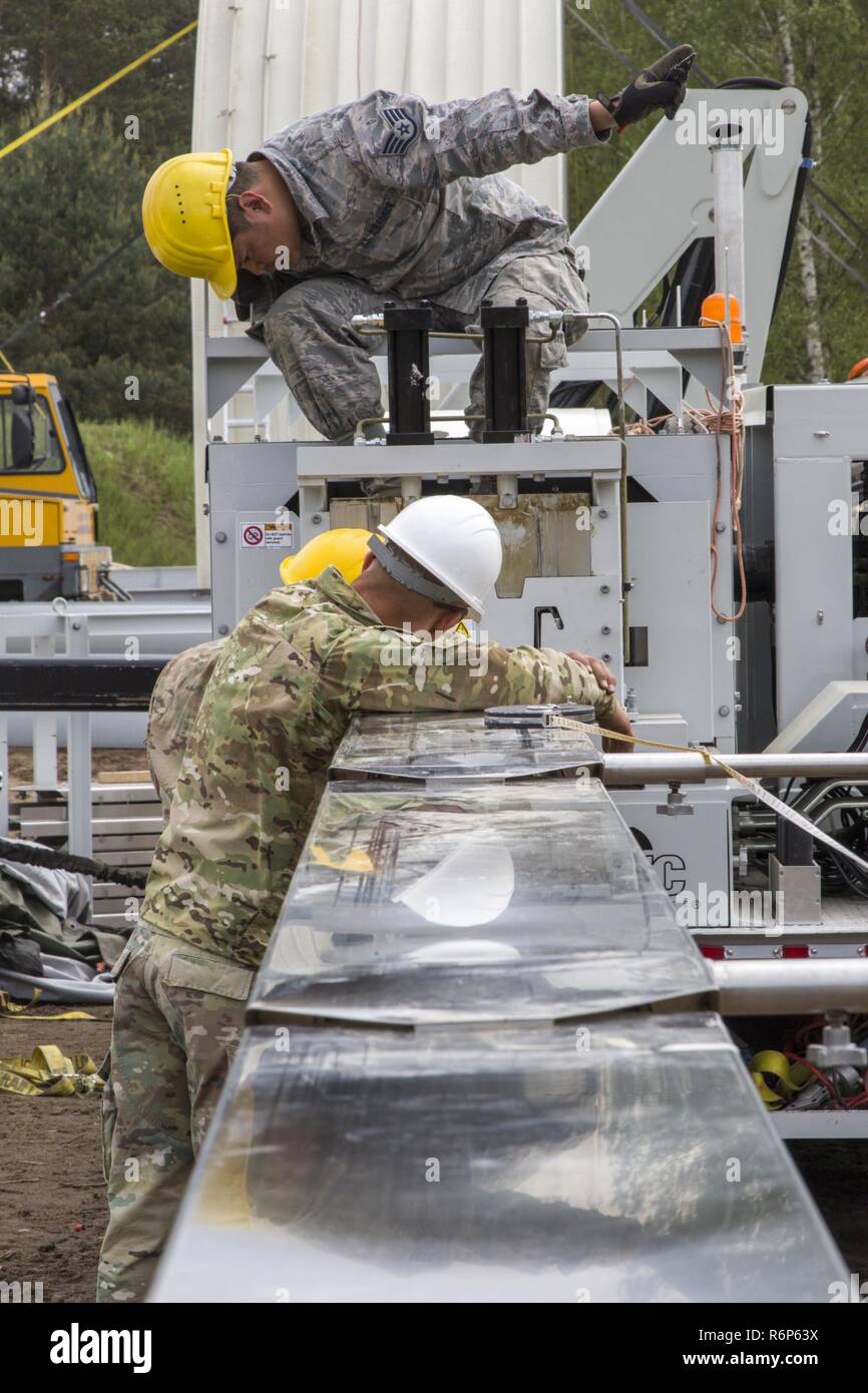 A U.S. Air Force airman directs U.S. Army Soldiers from the 902nd ...