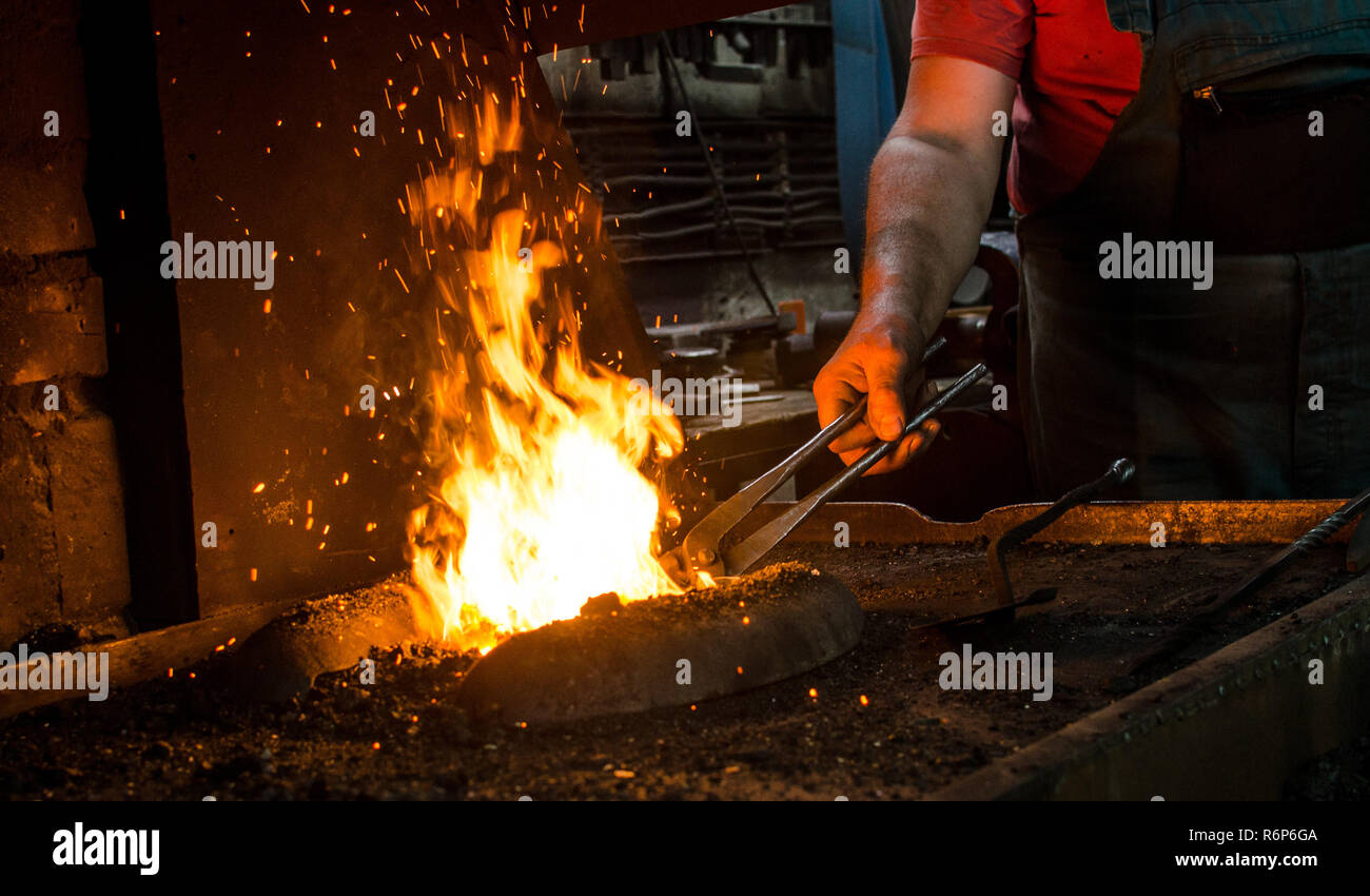 Blacksmith at work Stock Photo - Alamy