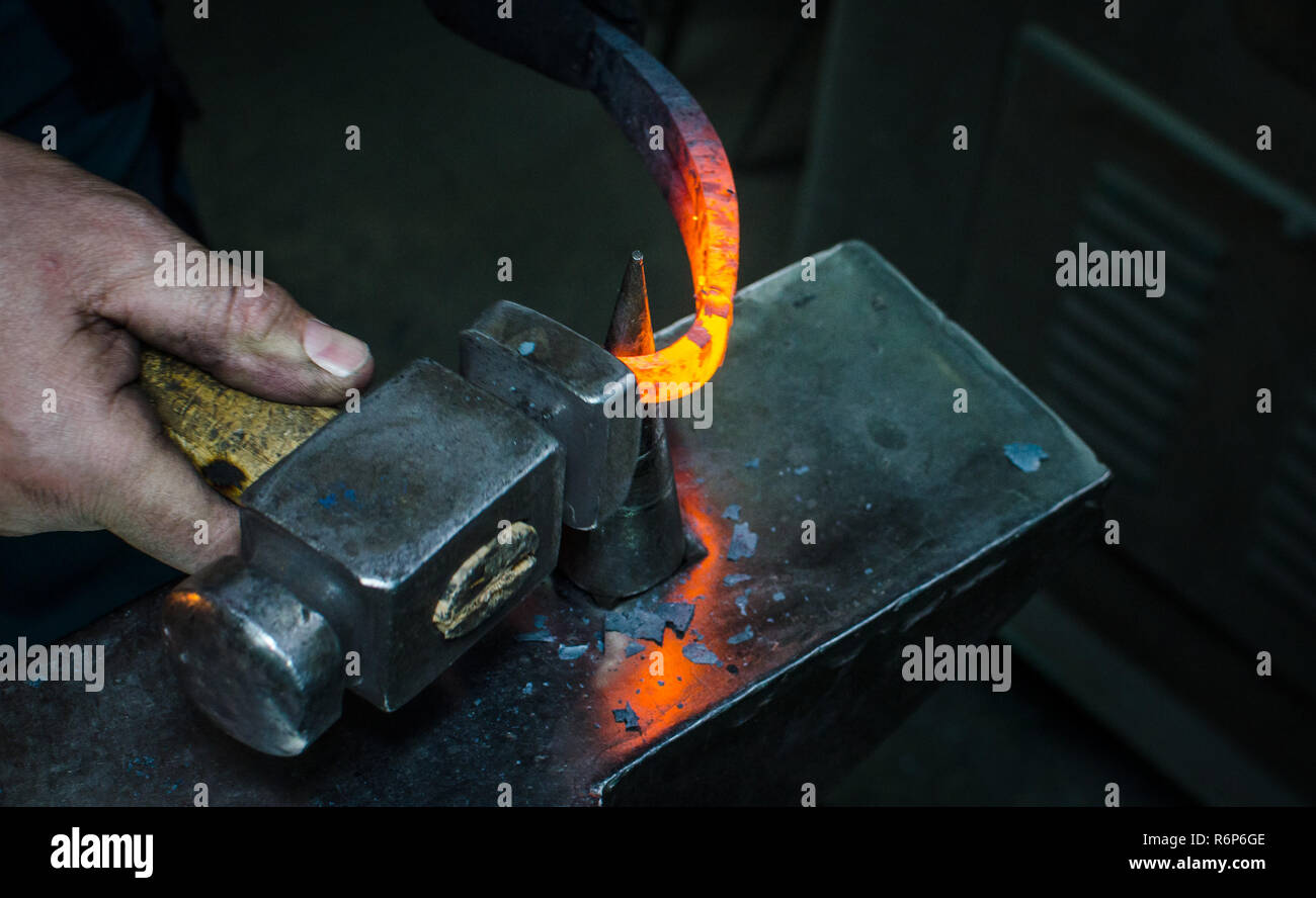 Blacksmith at work Stock Photo - Alamy