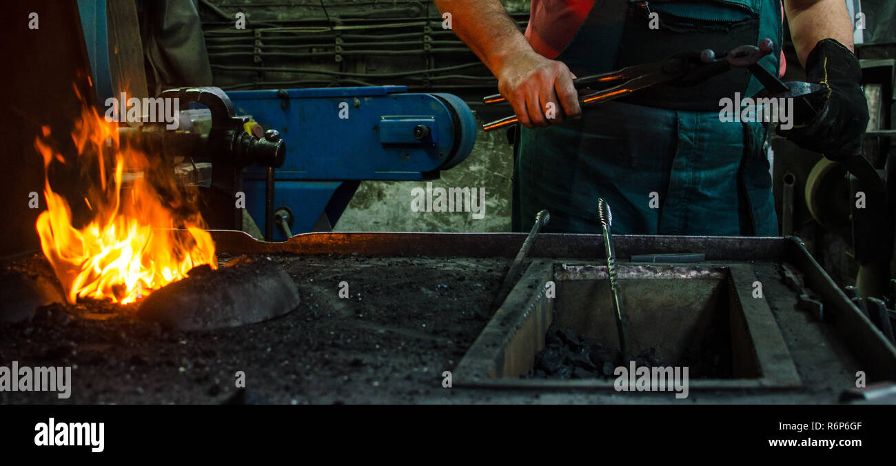 Blacksmith at work Stock Photo - Alamy