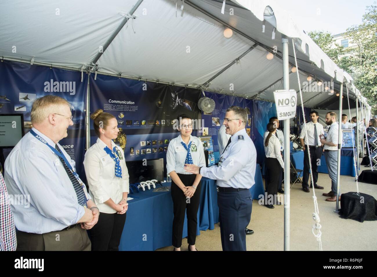 Maj. Gen. William Cooley, AFRL commander, talks with AFRL presenters ...