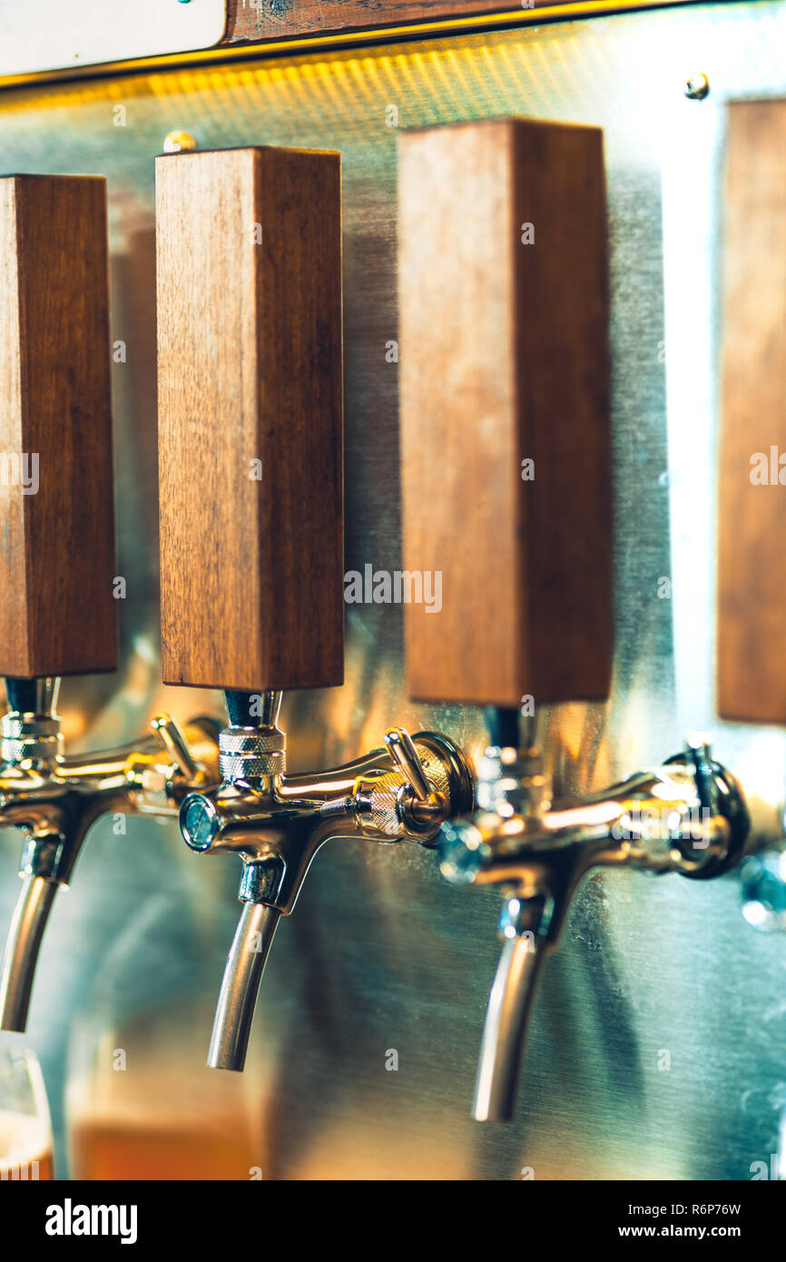 Beer craft. Bar table. Steel taps. Shiny taps. Glassses with beer Stock ...