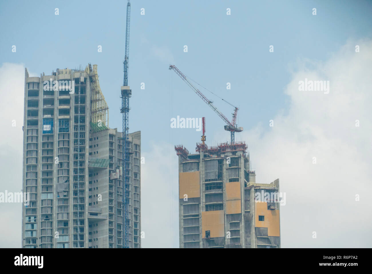 Inside place for many tall buildings under construction and cranes ...