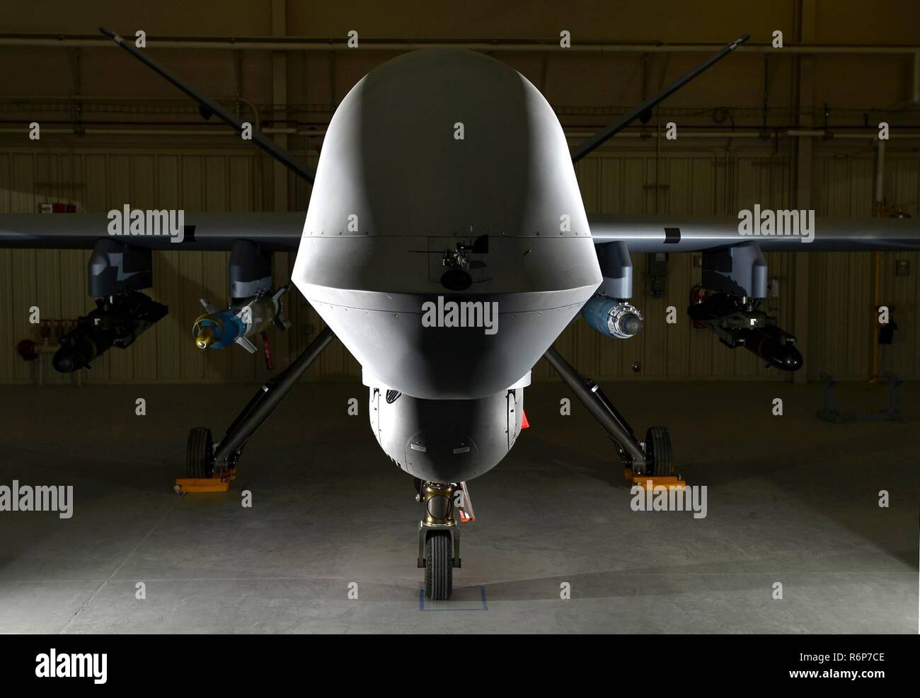 The new Block 5 MQ-9 Reaper is loaded with AGM-114 Hellfire missiles, a ...