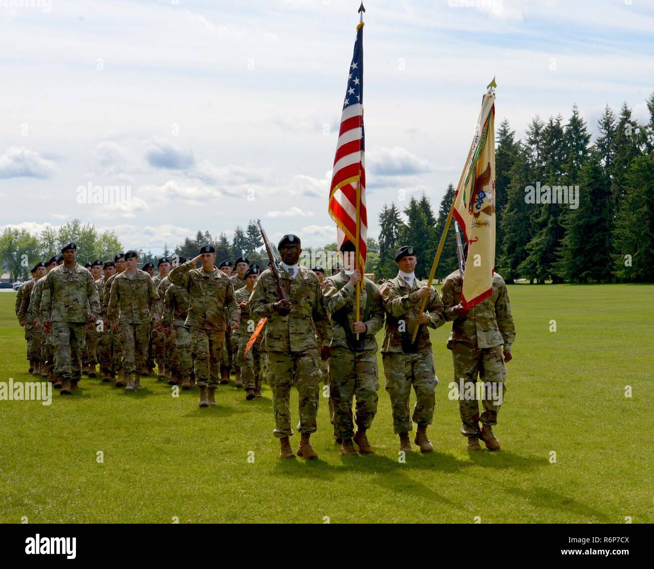 The 308th Brigade Support Battalion color guard passes in review during ...