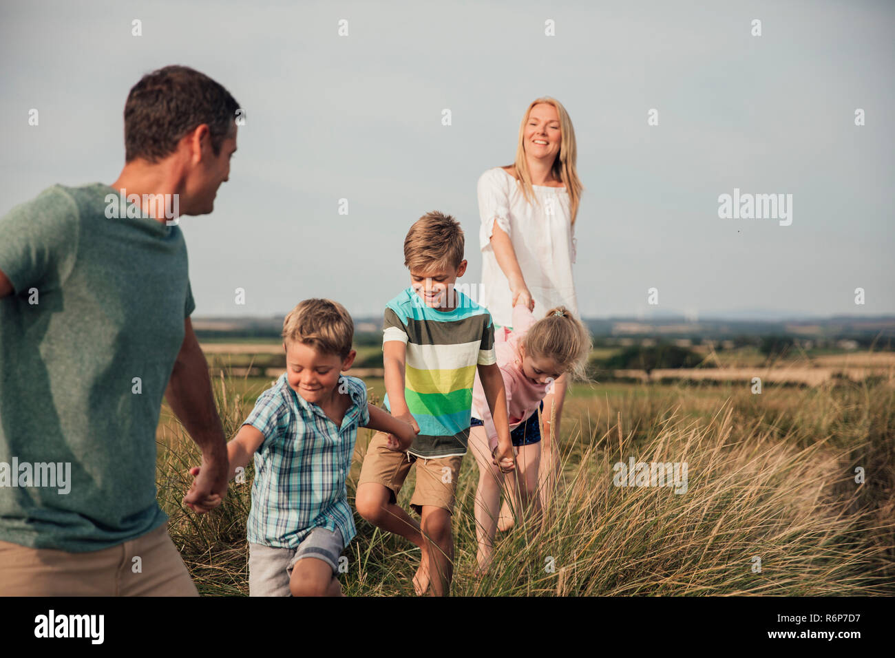 Family Walks Through the Sand Dunes Stock Photo - Alamy