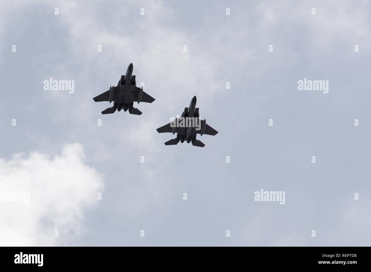 Two Republic of Singapore Air Force F-15SG aircraft fly in formation ...