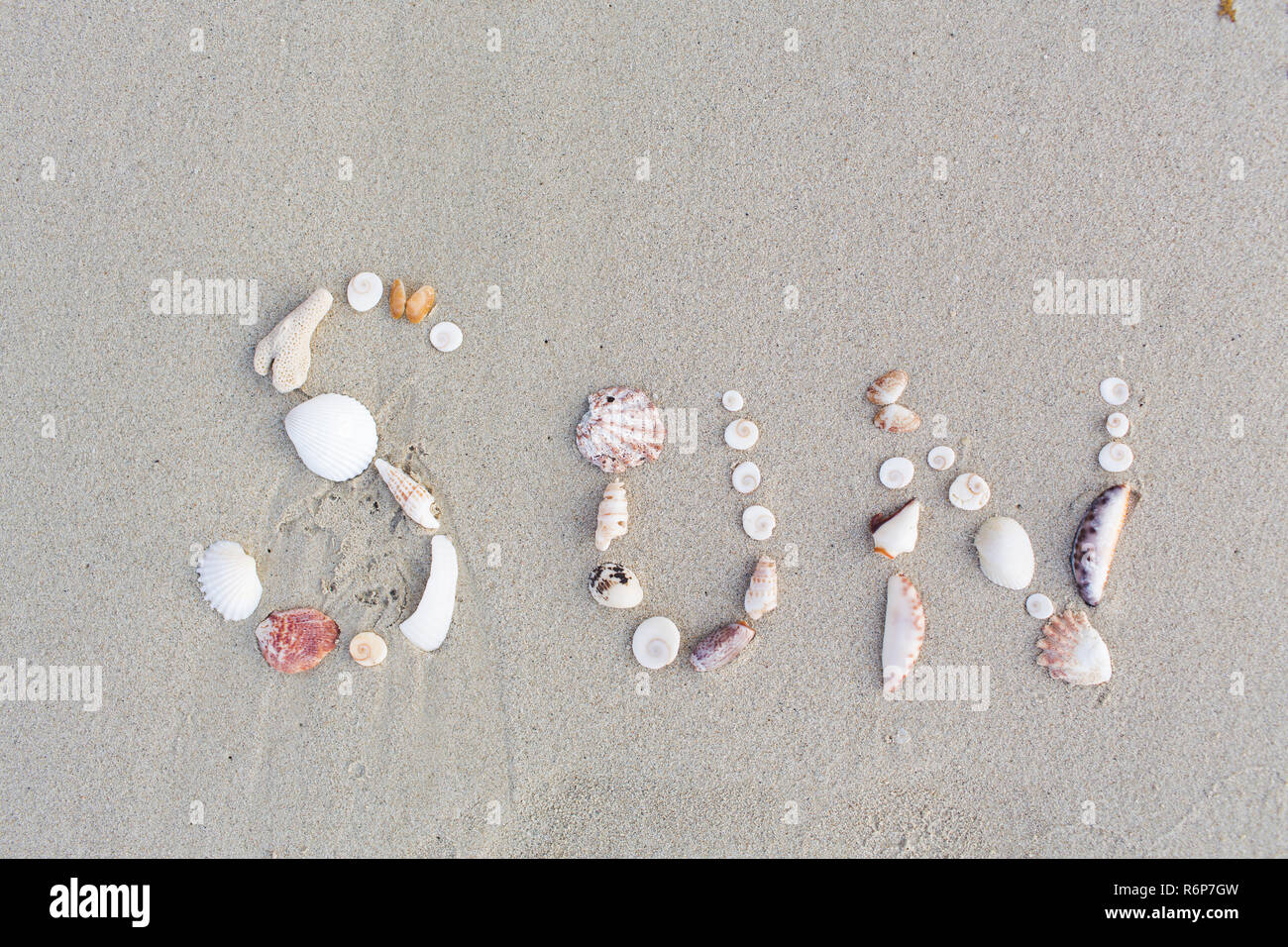 Word sun written shells hi-res stock photography and images - Alamy