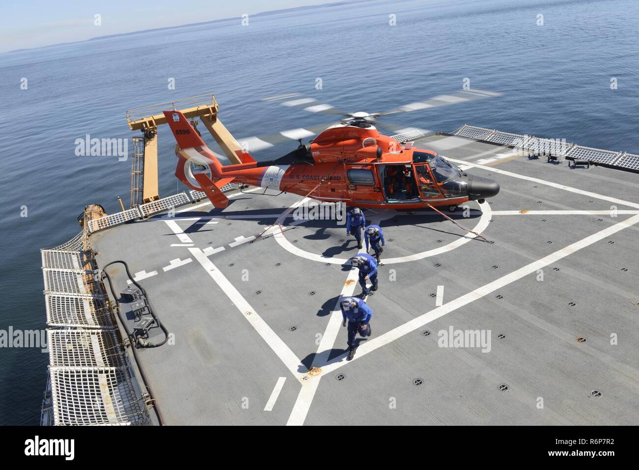 Crew members from the Coast Guard Cutter Healy, a 420-foot Medium ...