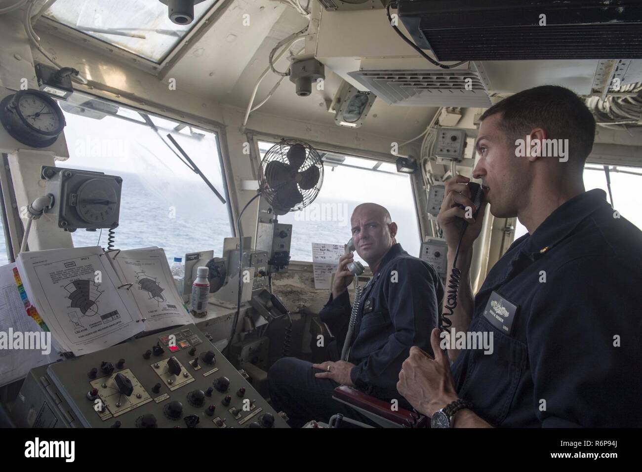 INDIAN OCEAN (Sept. 18, 2017) Lt. Brian Bieber, right, acting as the ...