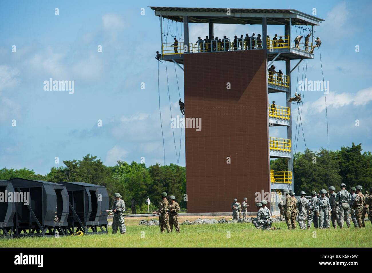U.S. Army and Air National Guardsmen run repelling exercises during Air ...