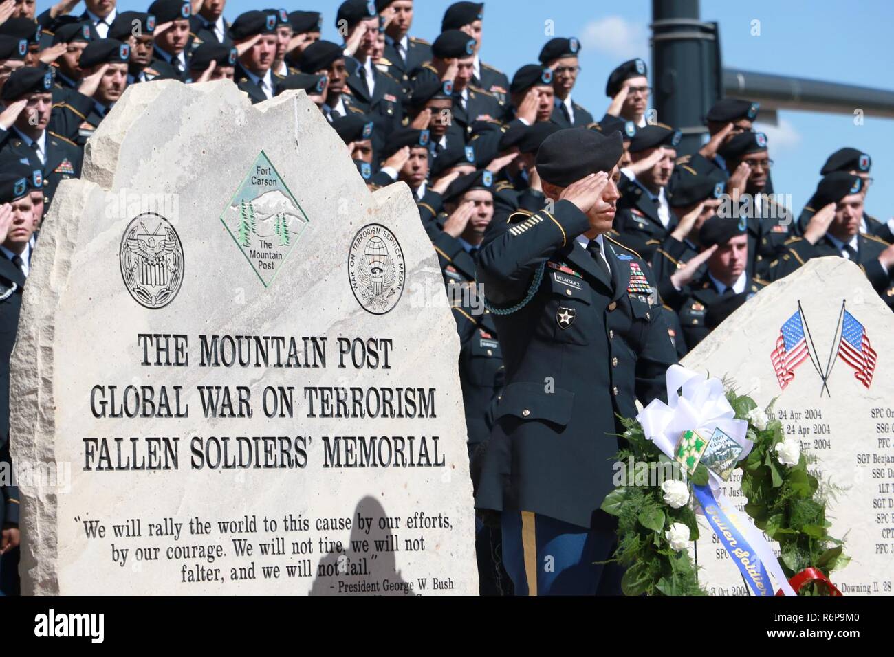 Fort Carson Soldiers salute during the playing of taps at the Mountain ...