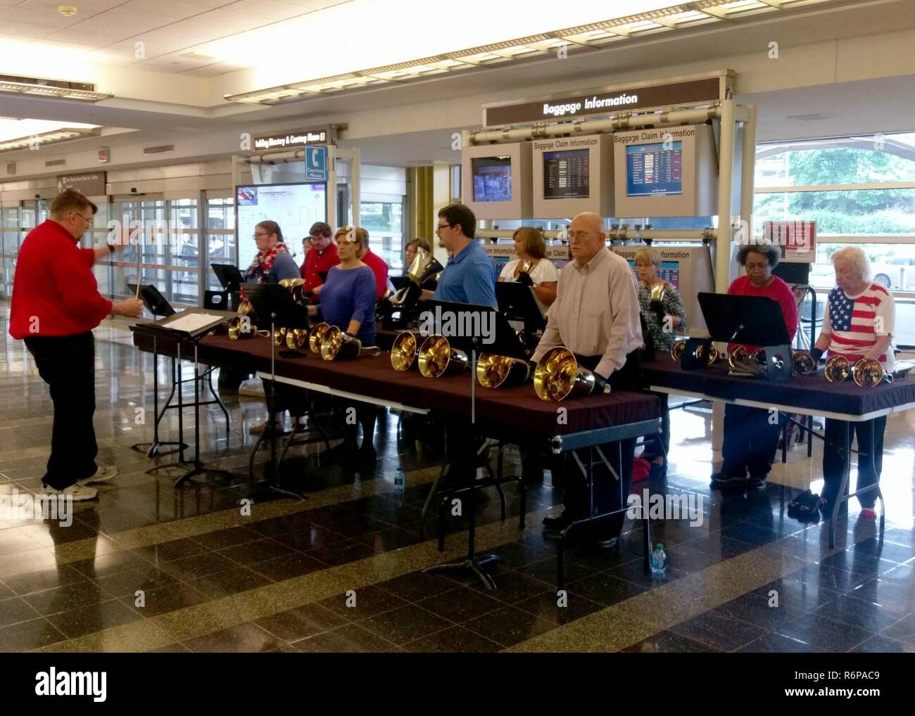 Members of the Stafford Regional Handbell Society play patriotic songs ...