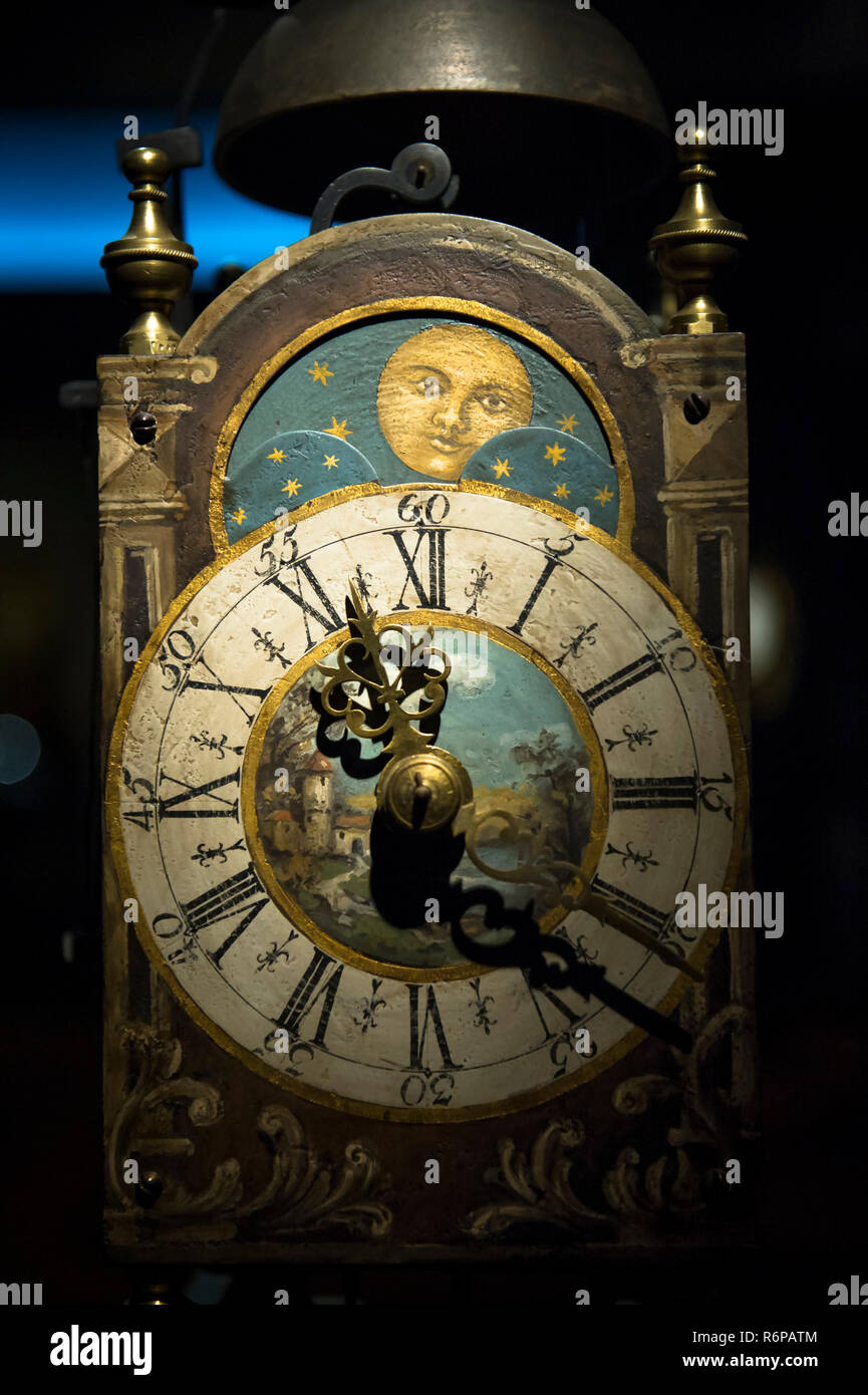 Old painted clock with moon face Stock Photo - Alamy