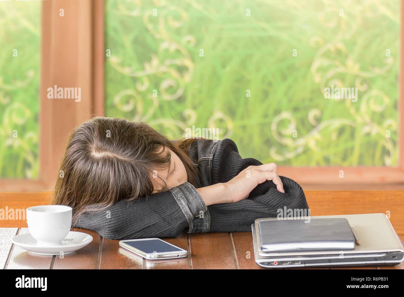 Woman Sleeping At Desk
