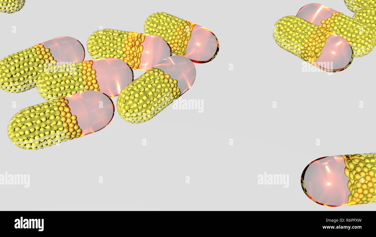 Close up view of shining capsule pills with small medicinal granules ...