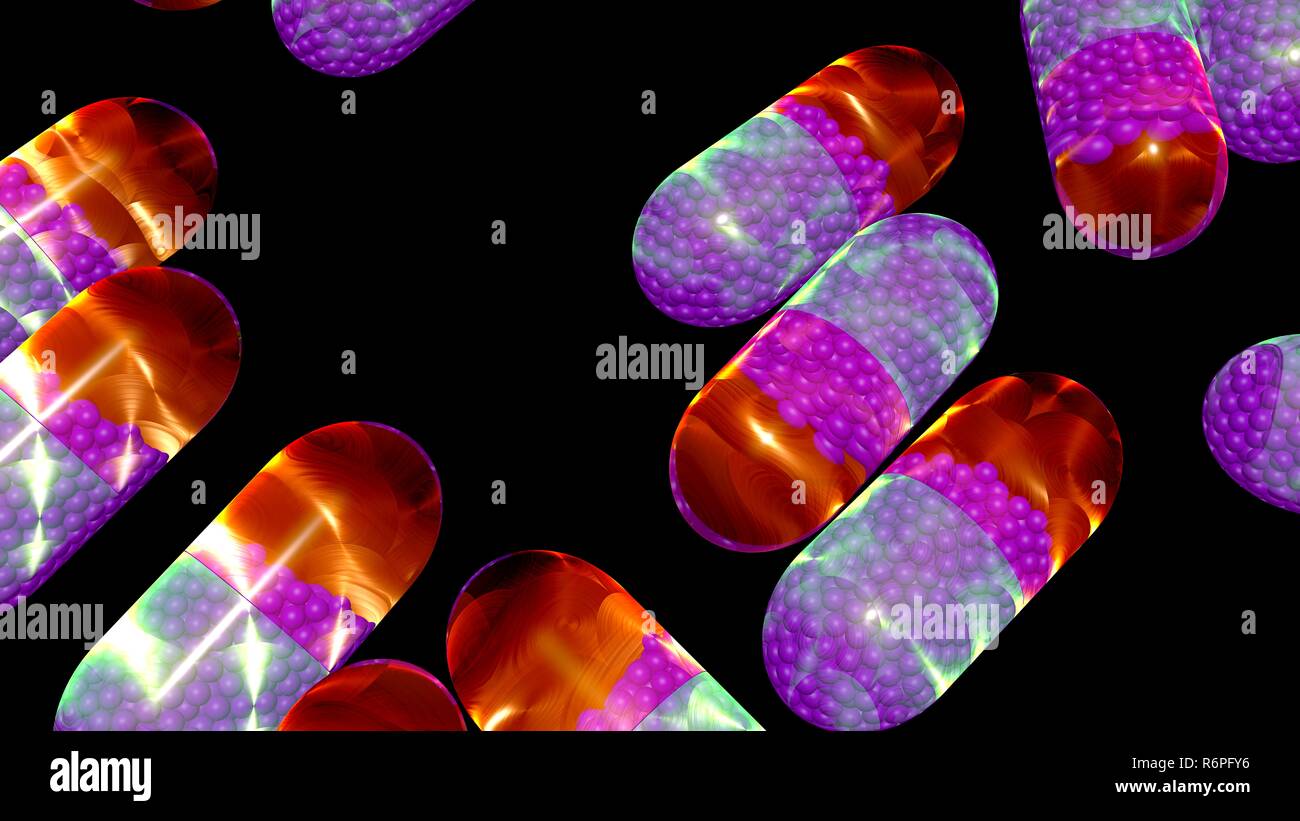 Close up view of shining capsule pills with small medicinal granules ...