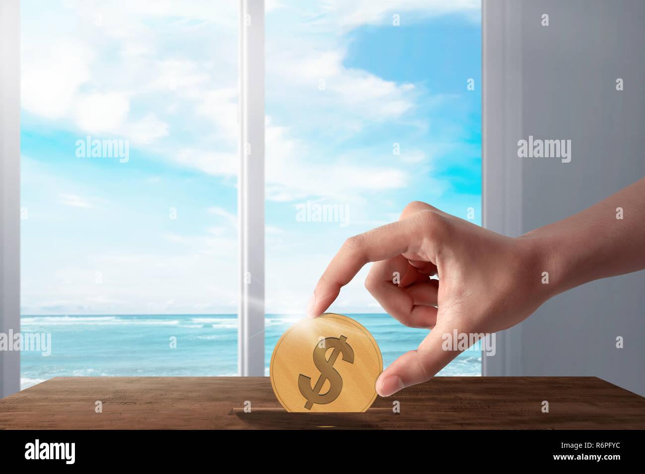 People hands put gold coin in to savings Stock Photo - Alamy