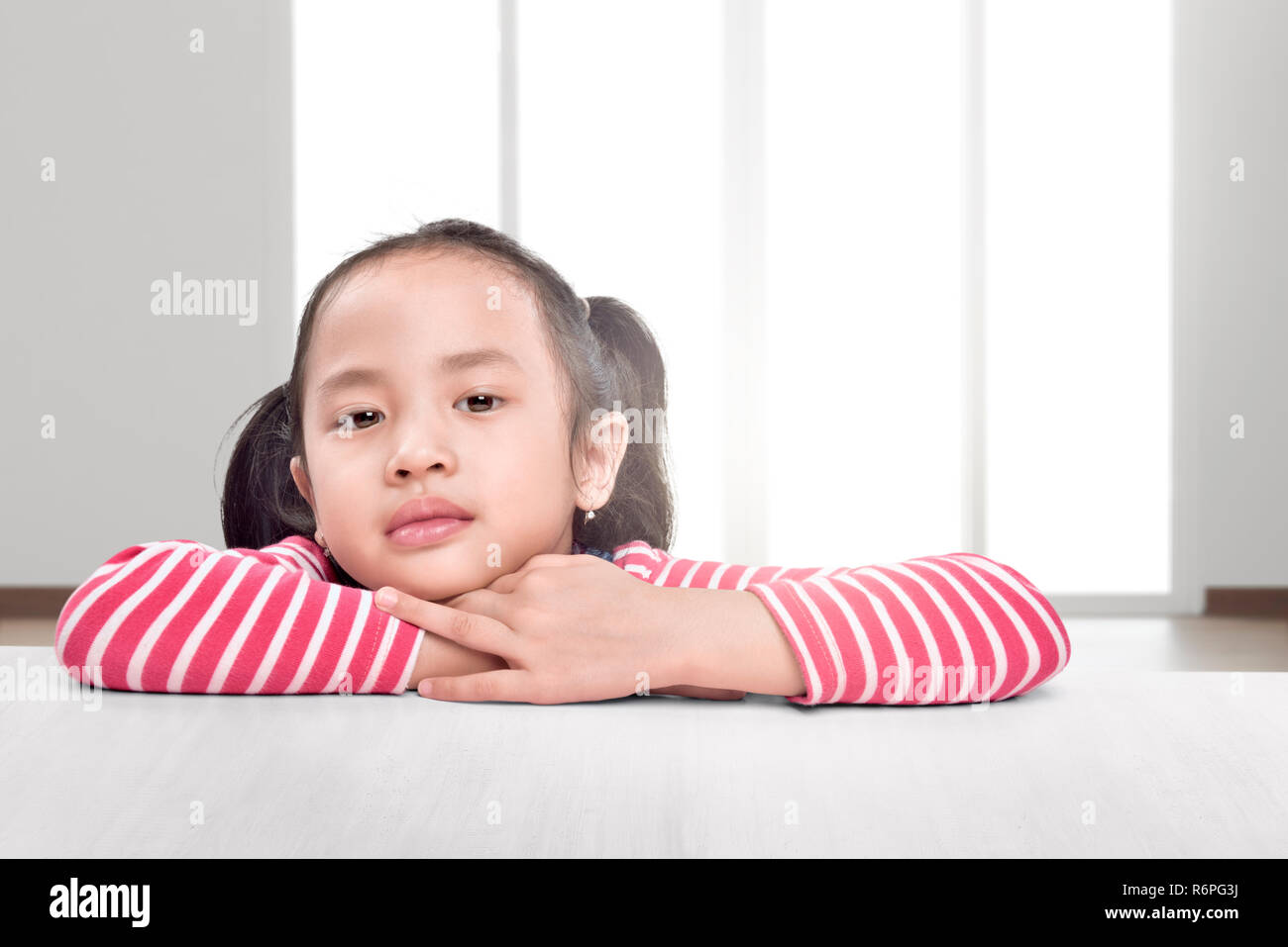 Excited asian children with relax lean on the table Stock Photo - Alamy