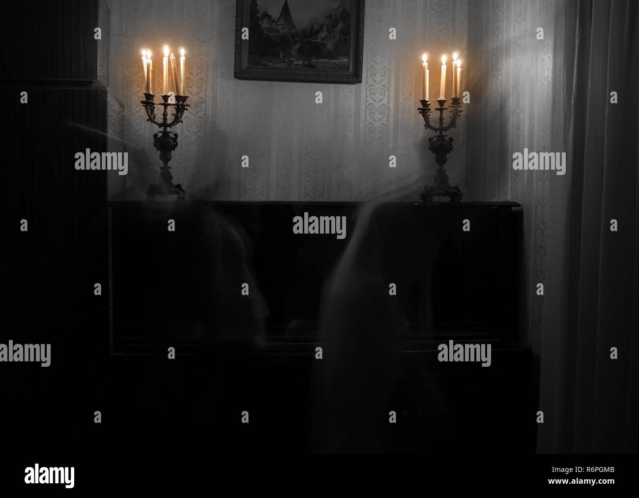 Ghost woman in room with candles Stock Photo - Alamy