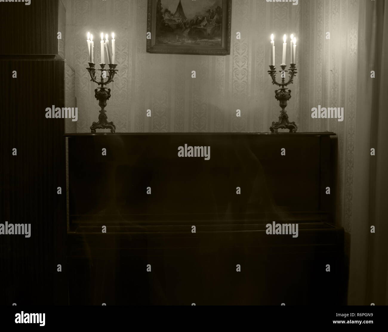 Ghost woman in room with candles Stock Photo - Alamy