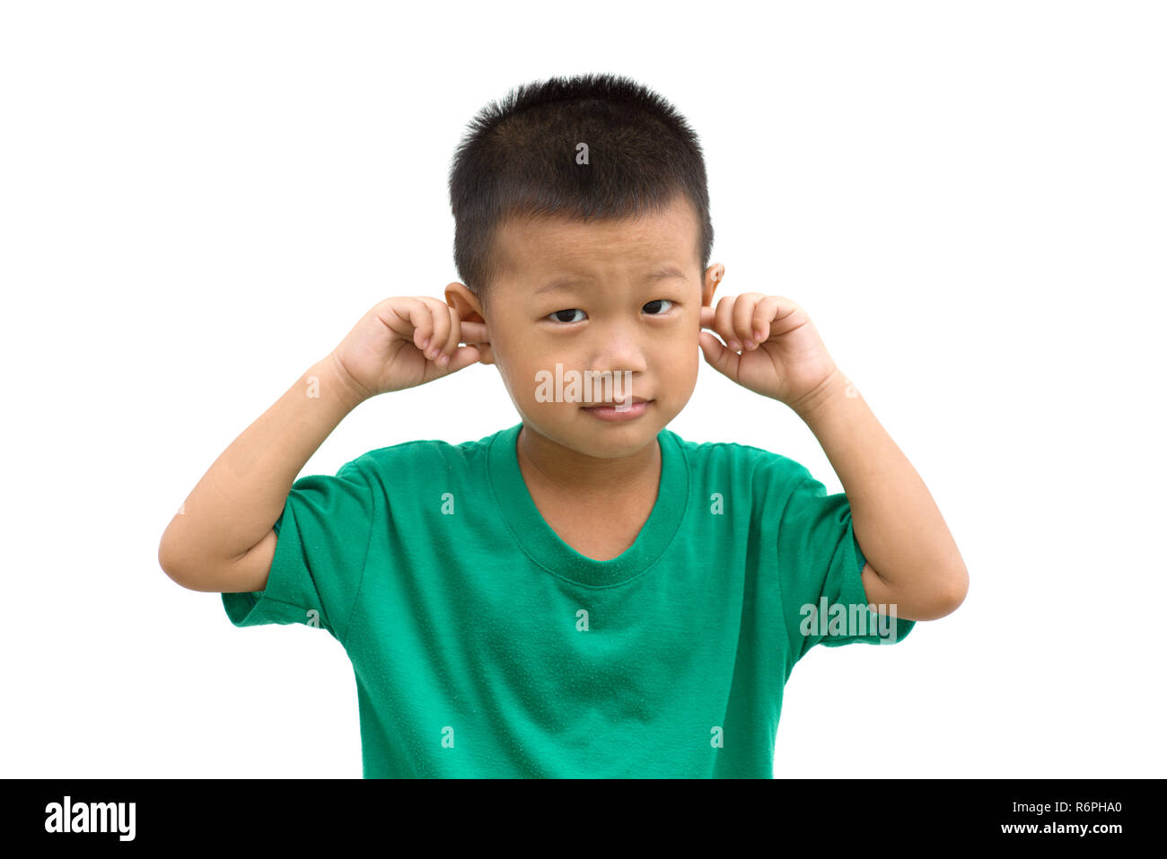 Asian boy covered his ears Stock Photo - Alamy
