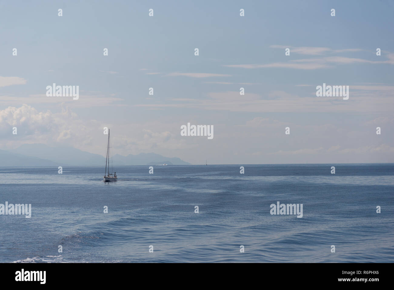 Sailboat without sail over the sea Stock Photo - Alamy