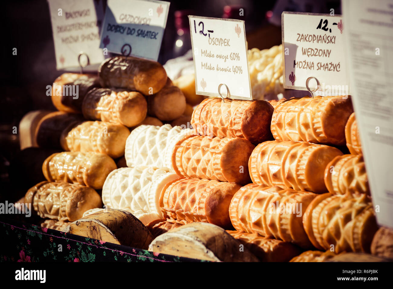 traditional polish smoked cheese oscypek on outdoor market in zakopane ...