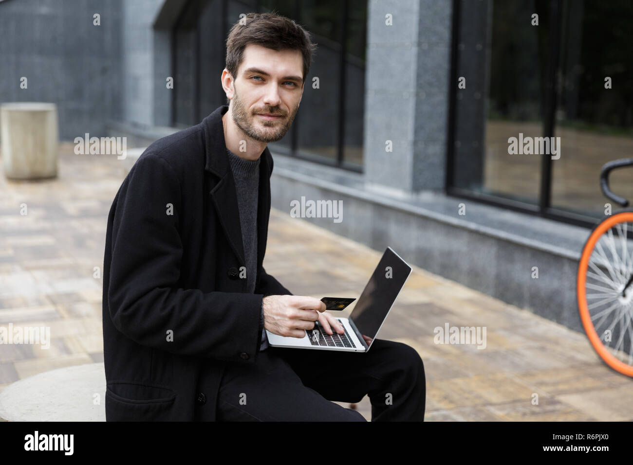 Smiling employee man using computer hi-res stock photography and images ...