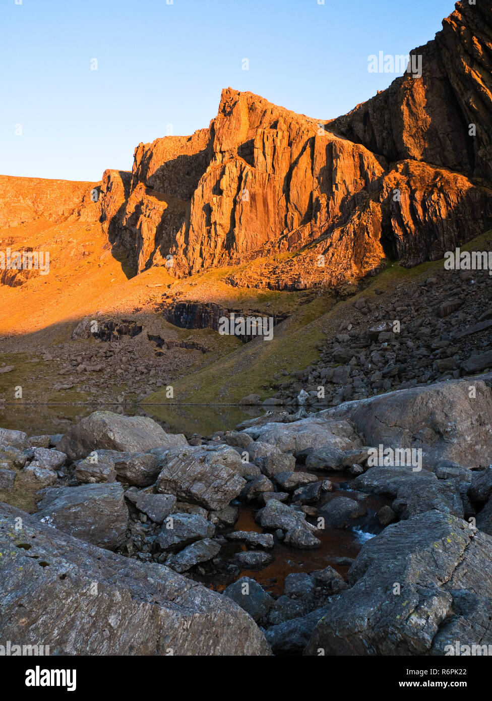 Sunset of the great crag of Clogwyn Du'r Arddu, aka 'Cloggy', on the ...