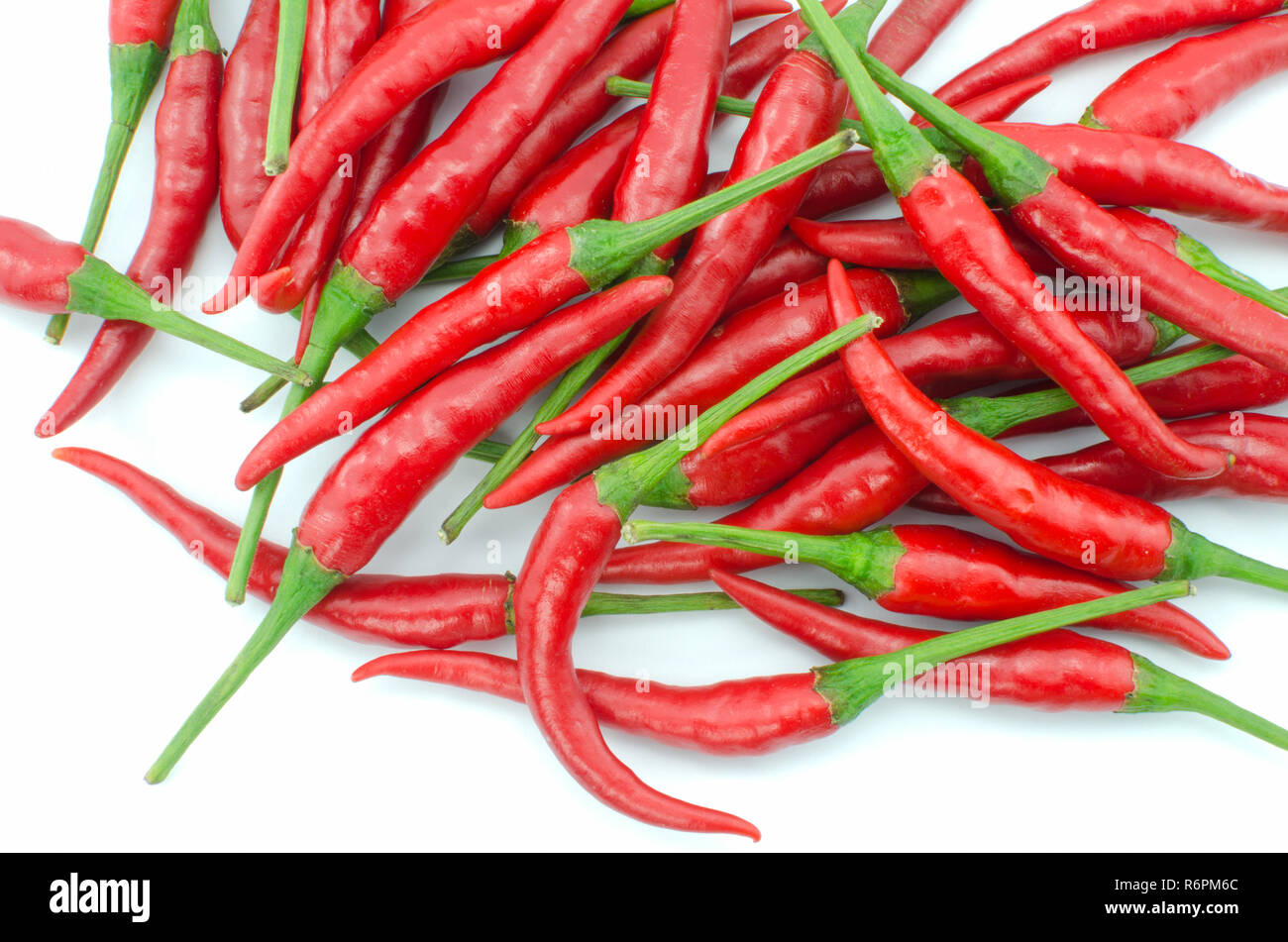 Stack of hot chili pepper or small chili padi, isolated on white ...