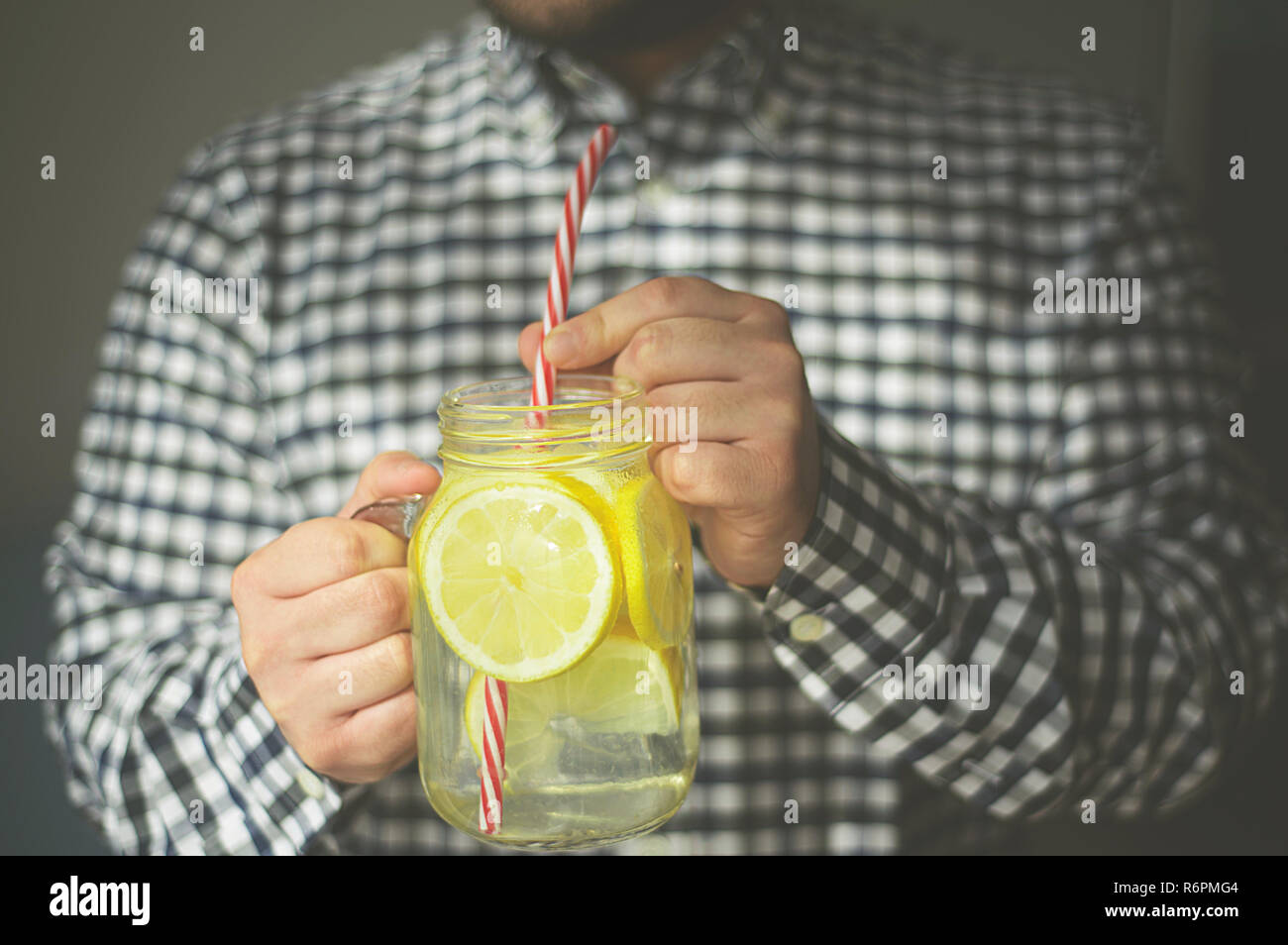 a man drinking fresh drink home made lemonade froma jar mug Stock Photo ...