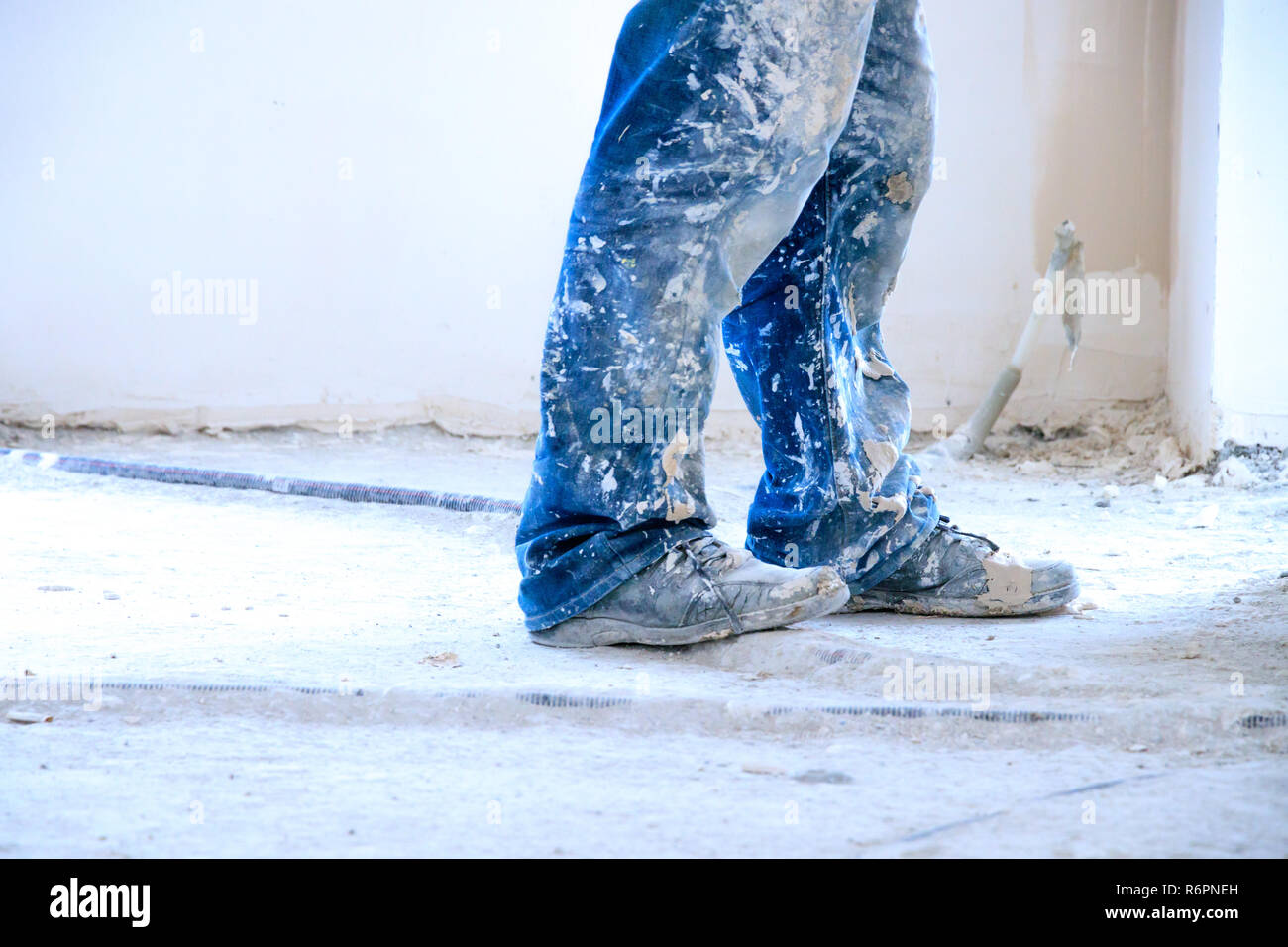 Construction worker with jeans and street shoes Stock Photo - Alamy