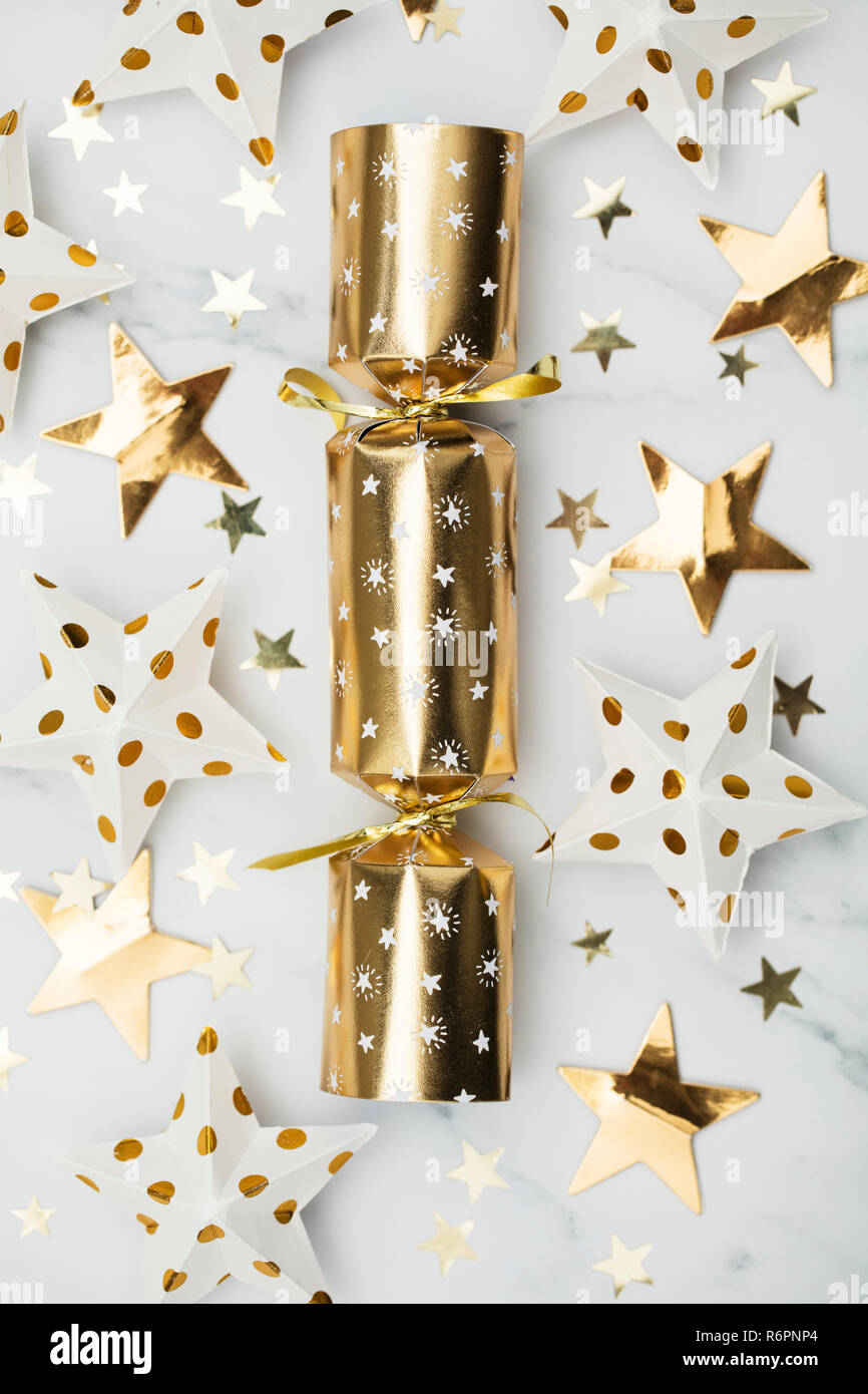 Christmas crackers. luxury gold festive cracker on a marble background ...