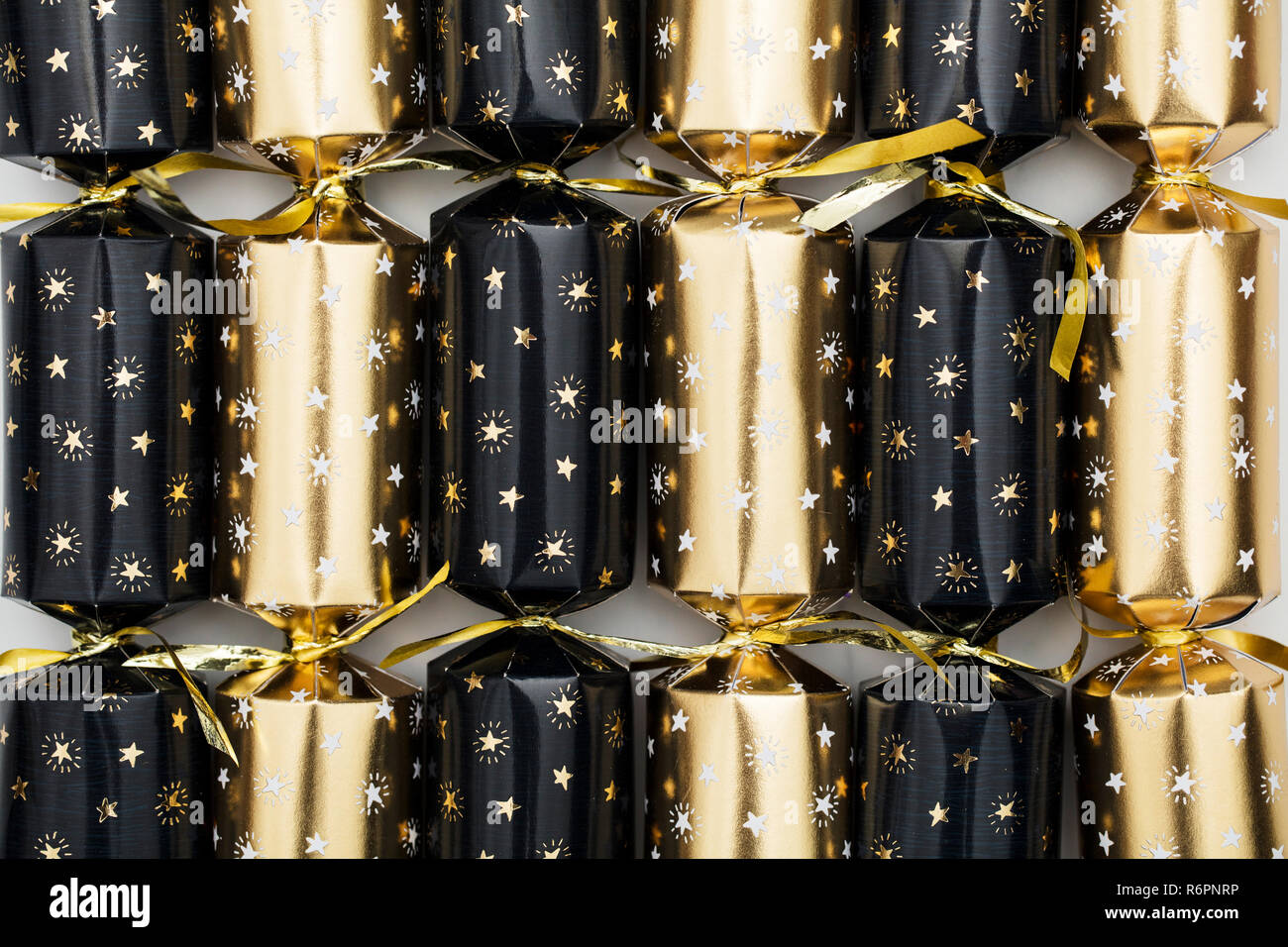 Christmas crackers. luxury gold and black festive crackers on a marble ...