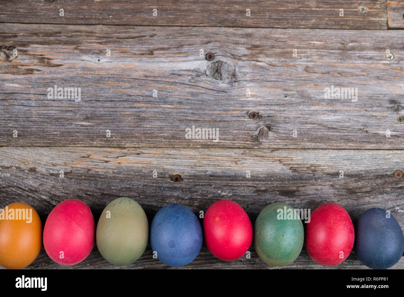 different easter eggs on gray wooden ground Stock Photo - Alamy