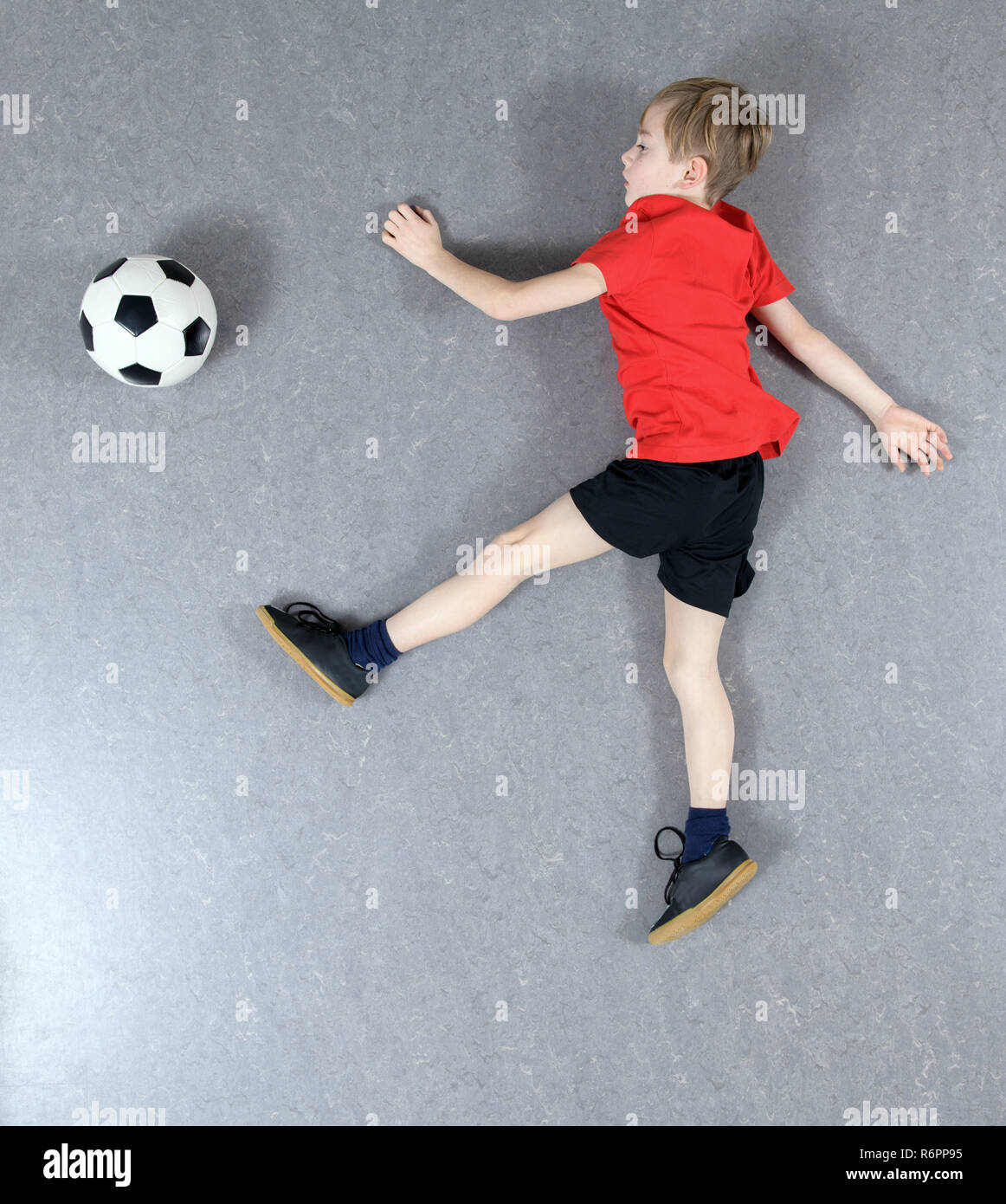 boy from above playing soccer ball Stock Photo - Alamy