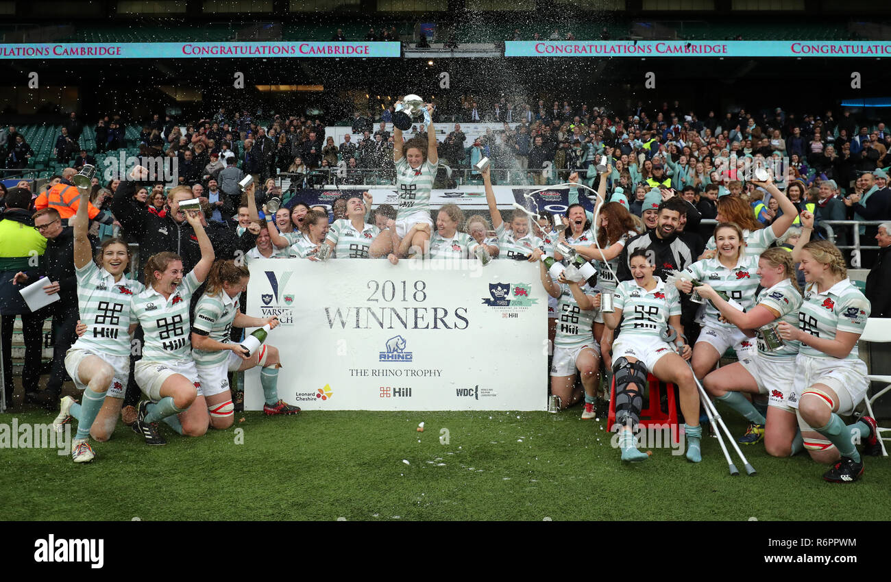 Cambridge captain Kate Marks (centre) lifts the trophy after winning ...