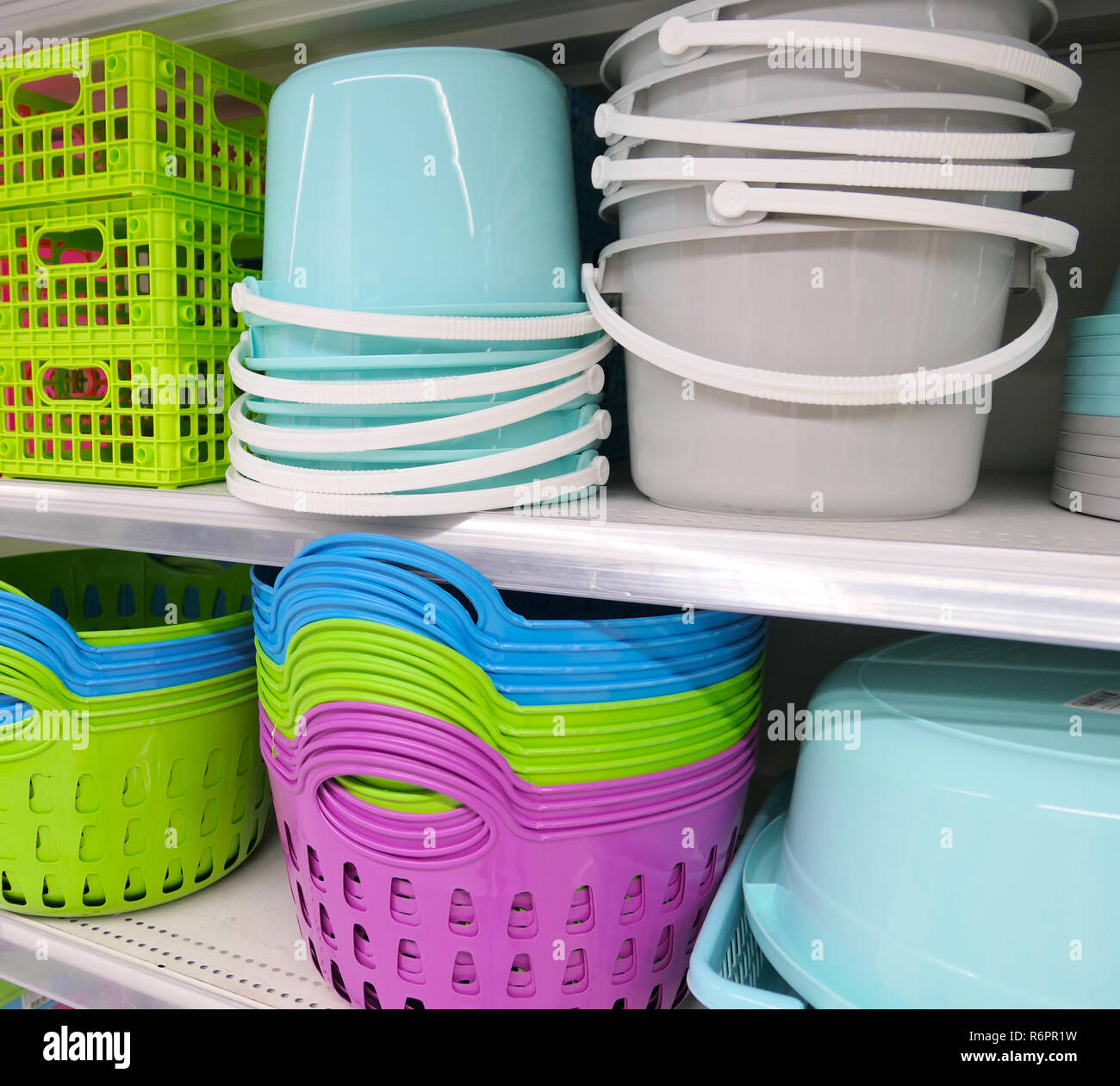 Stacks of buckets and buskets on shelves Stock Photo - Alamy