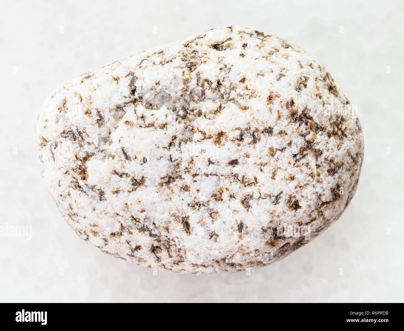 white Granite stone on white marble background Stock Photo - Alamy