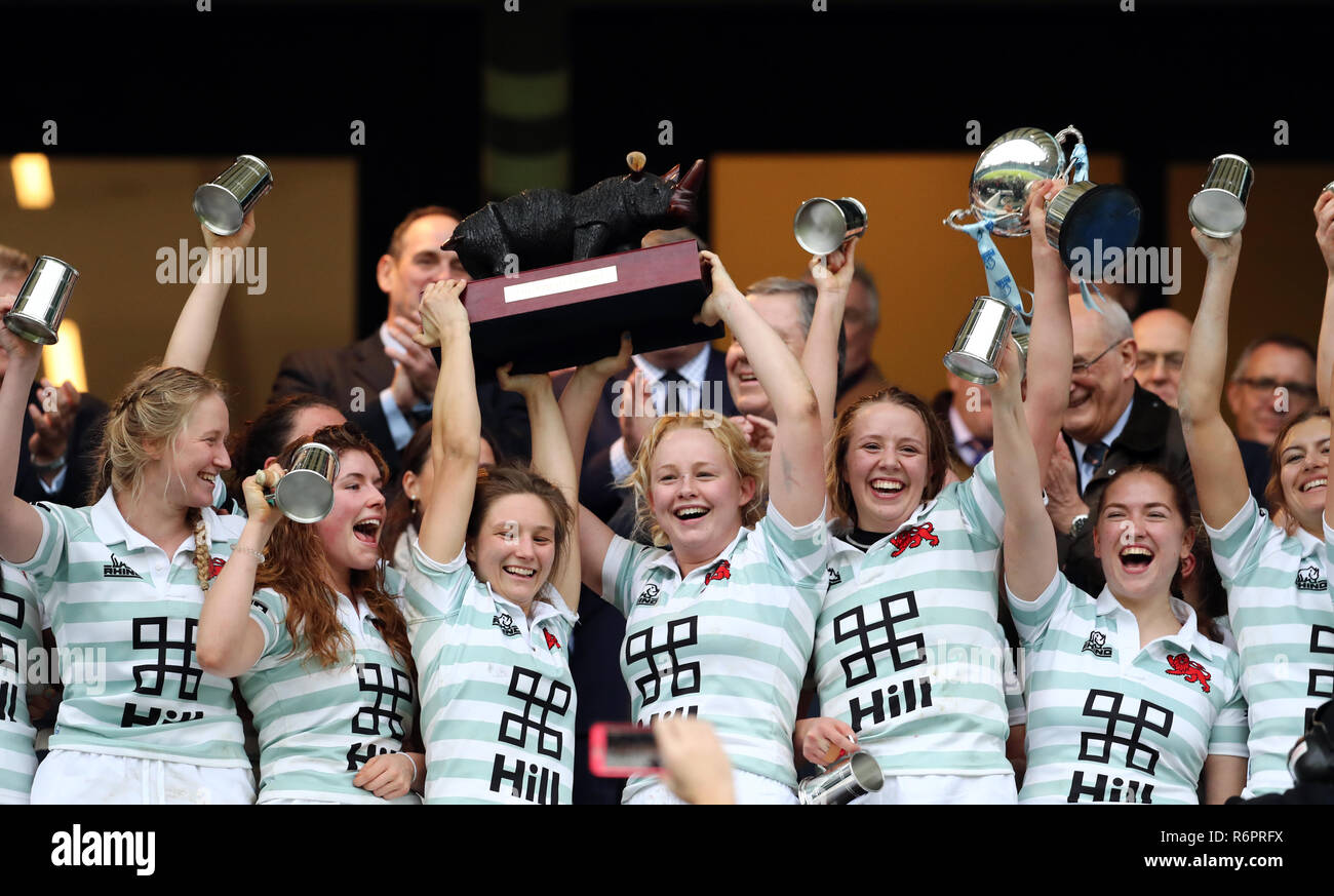 Cambridge captain Kate Marks (third from left) lifts the winners trophy ...