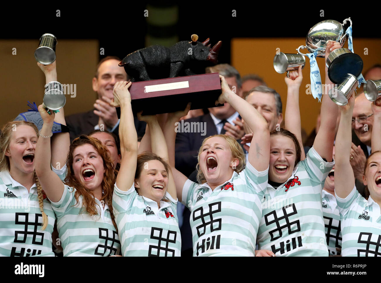 Cambridge captain Kate Marks (third from left) lifts the winners trophy ...