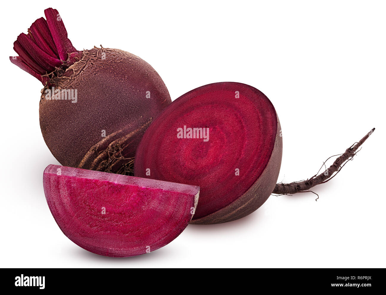 Fresh red beet root one cut in half and slice isolated on white ...