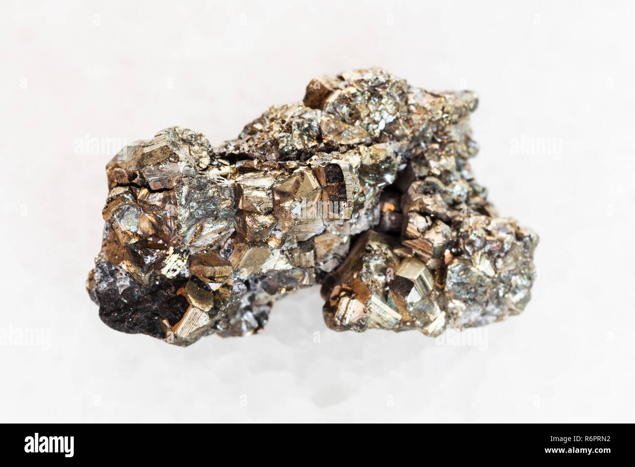 rough pyrite stone on white marble Stock Photo - Alamy
