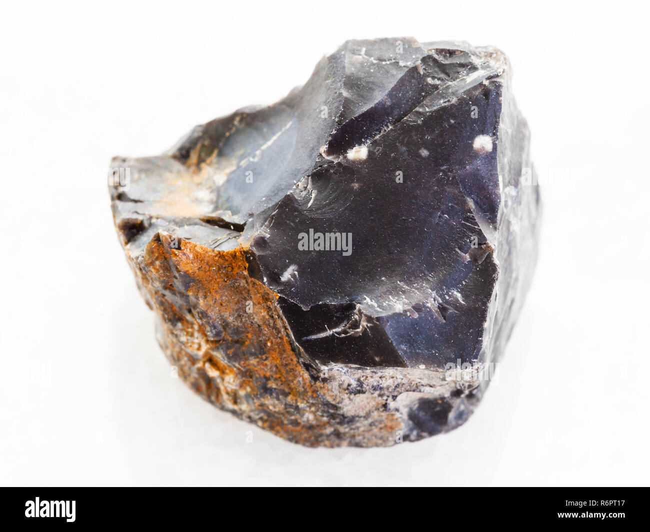 raw black Flint stone on white marble Stock Photo - Alamy