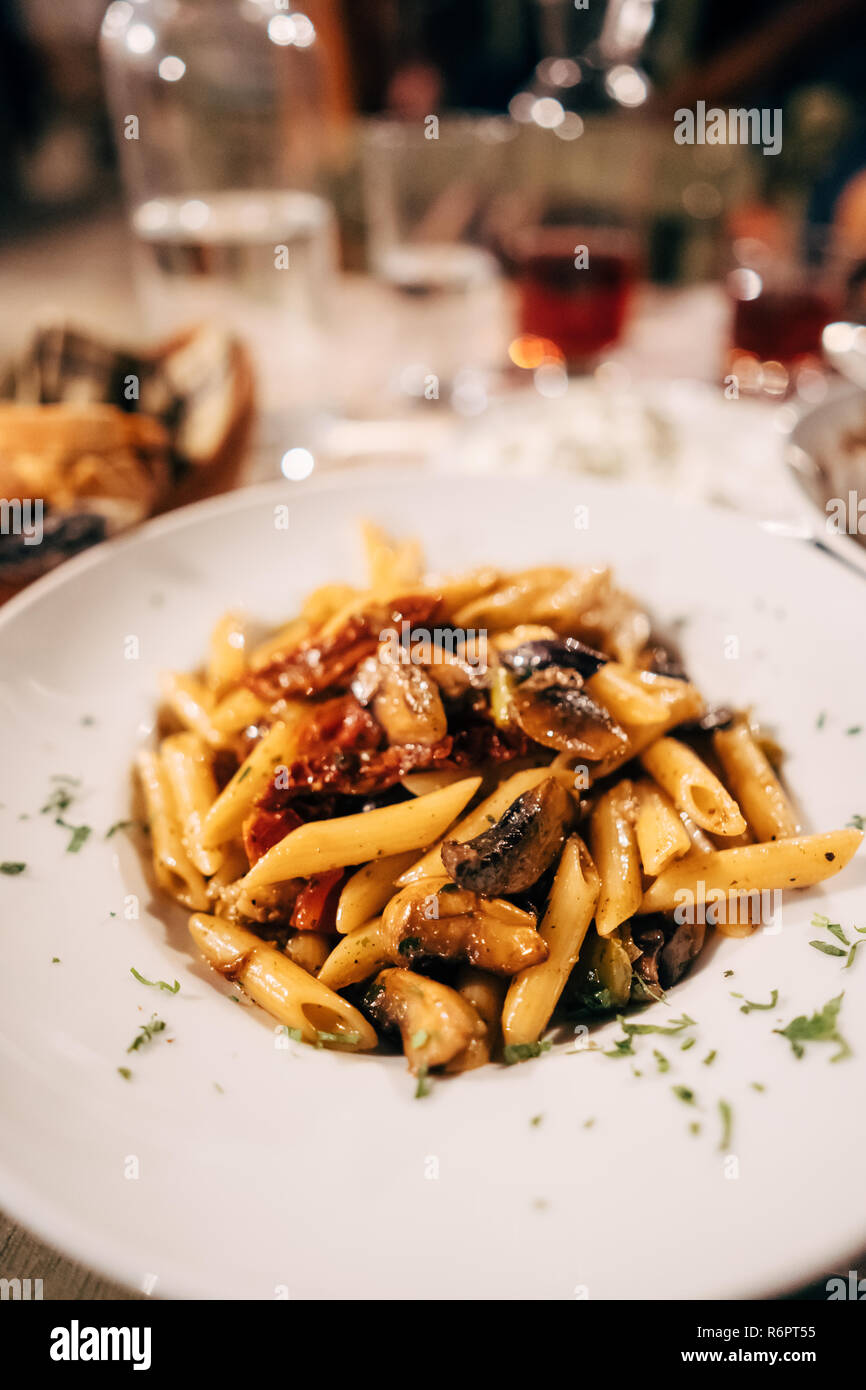 Pasta seashells with minced meat on the table Stock Photo - Alamy